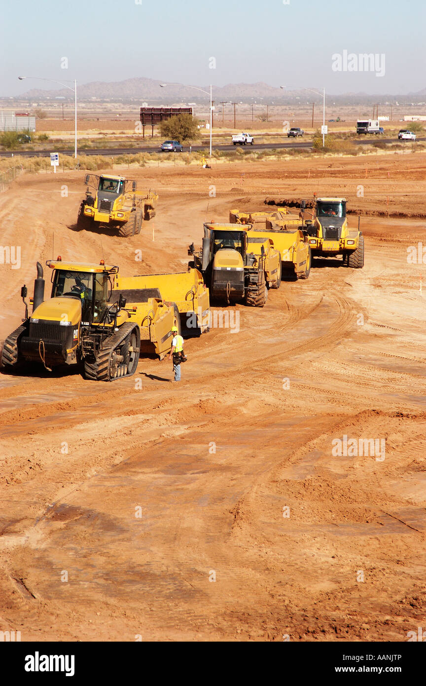 earthmoving equipment at work preparing a construction site for ...