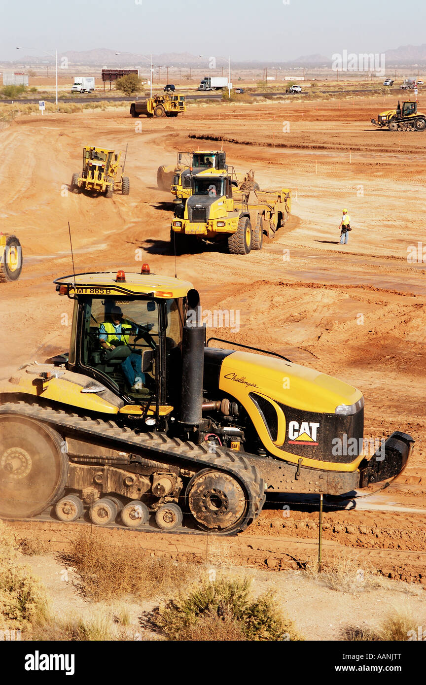 earthmoving equipment at work preparing a construction site for ...