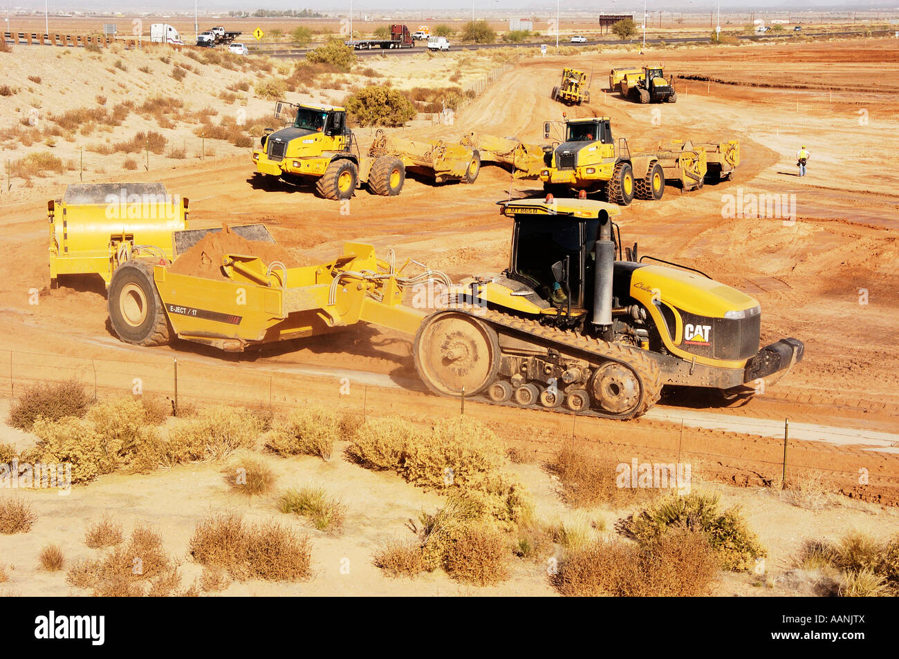 earthmoving equipment at work preparing a construction site for ...