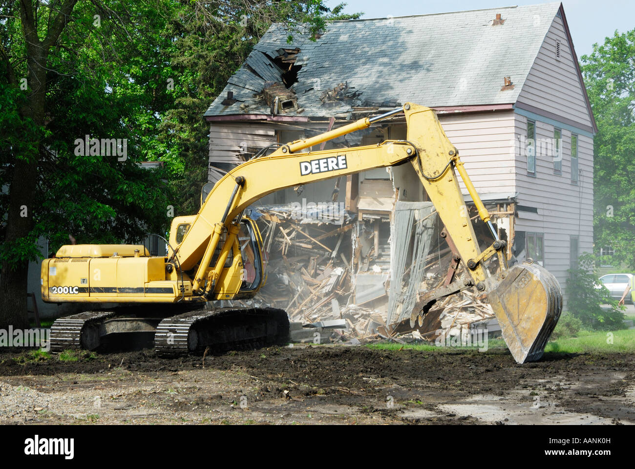 the demolition of a wood frame building to make room for commercial ...