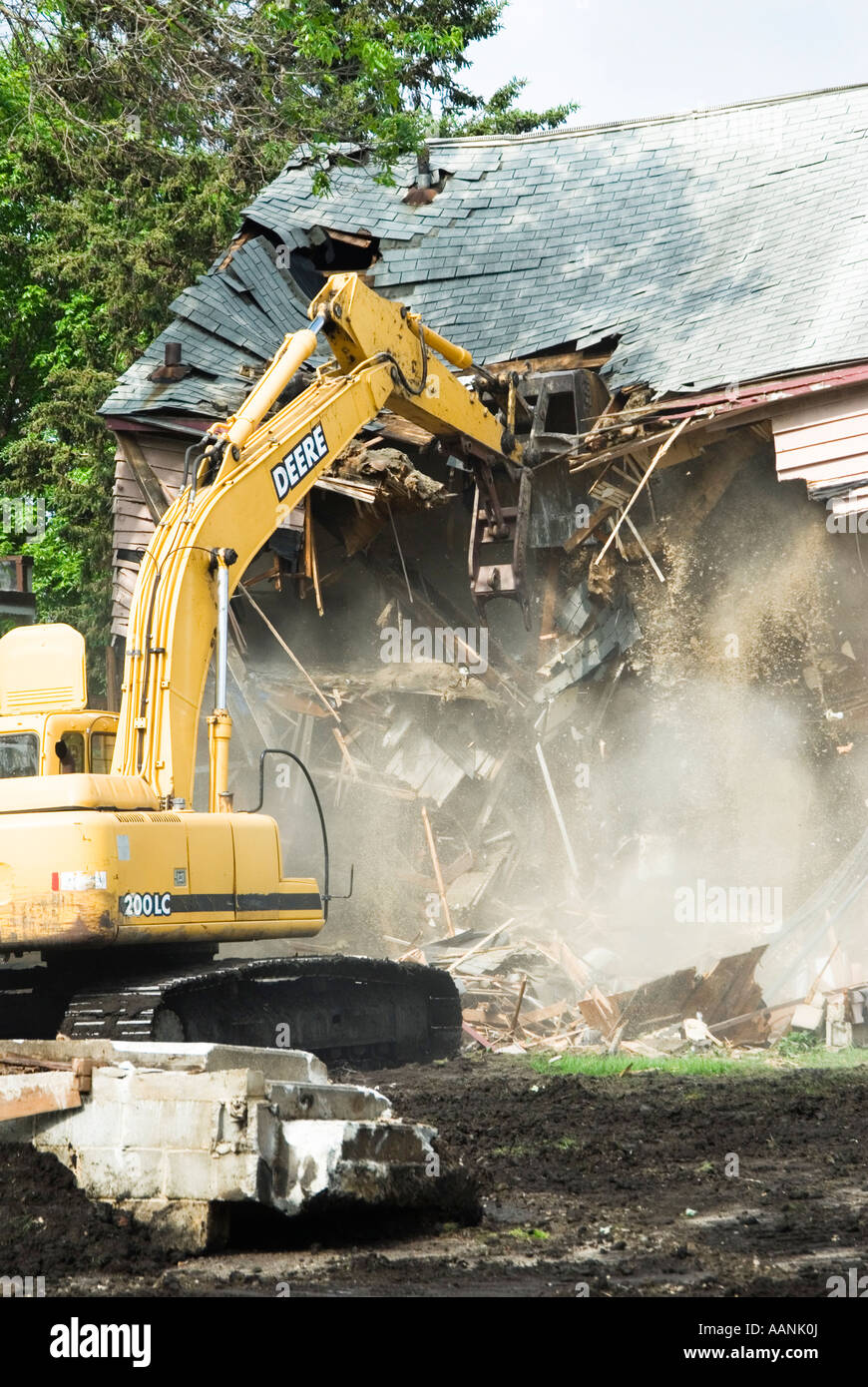 the demolition of a wood frame house to make room for commercial ...