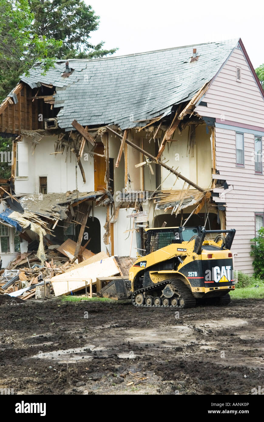 the demolition of a wood frame house to make room for commercial ...