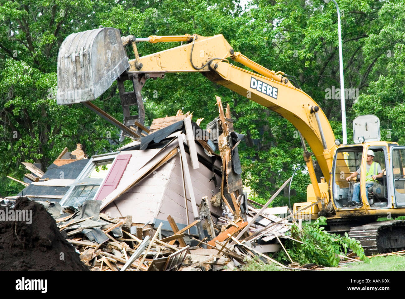 the demolition of a wood frame house to make room for commercial ...