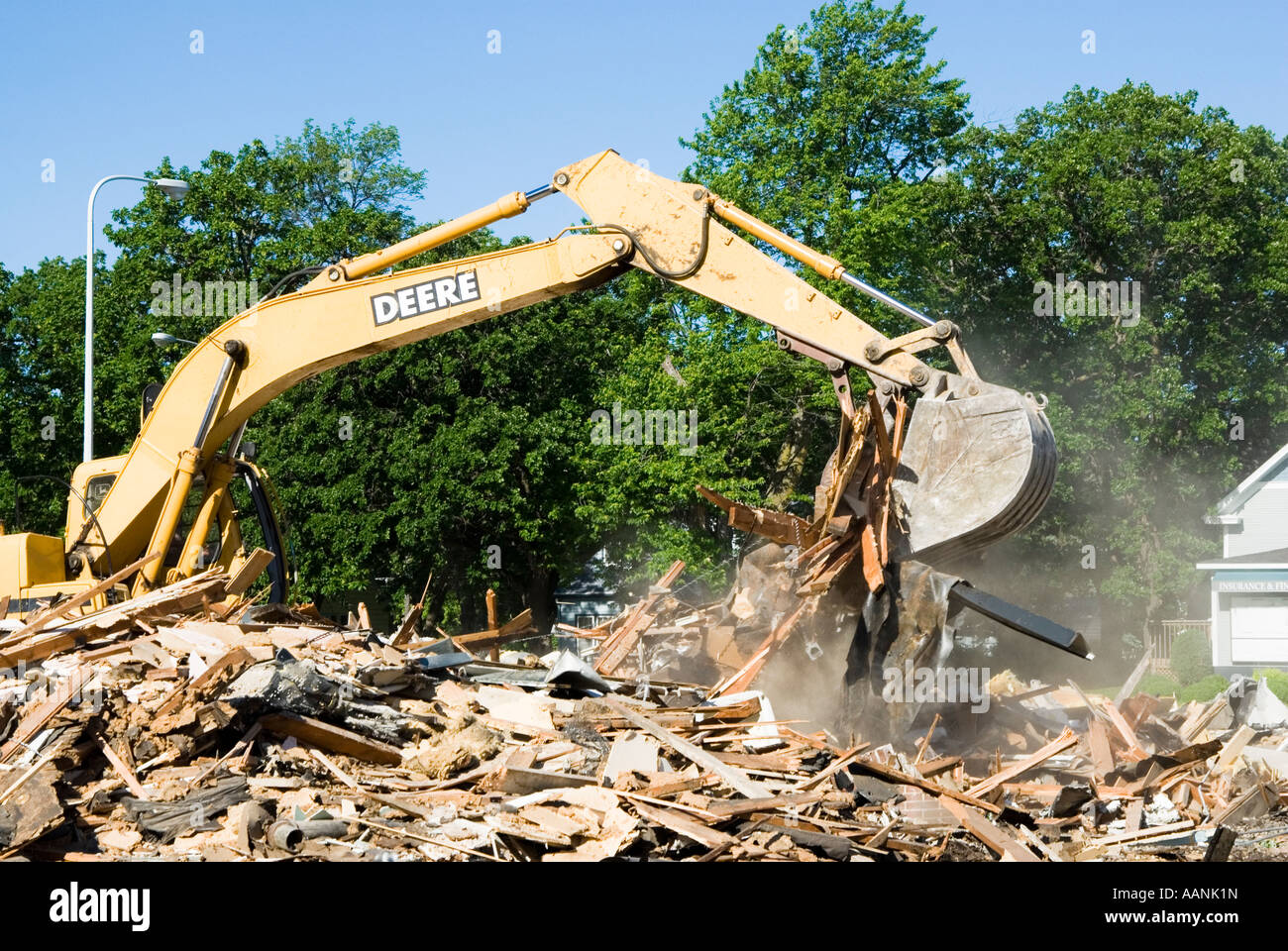 the cleanup after demolition of a wood frame building to make room for ...