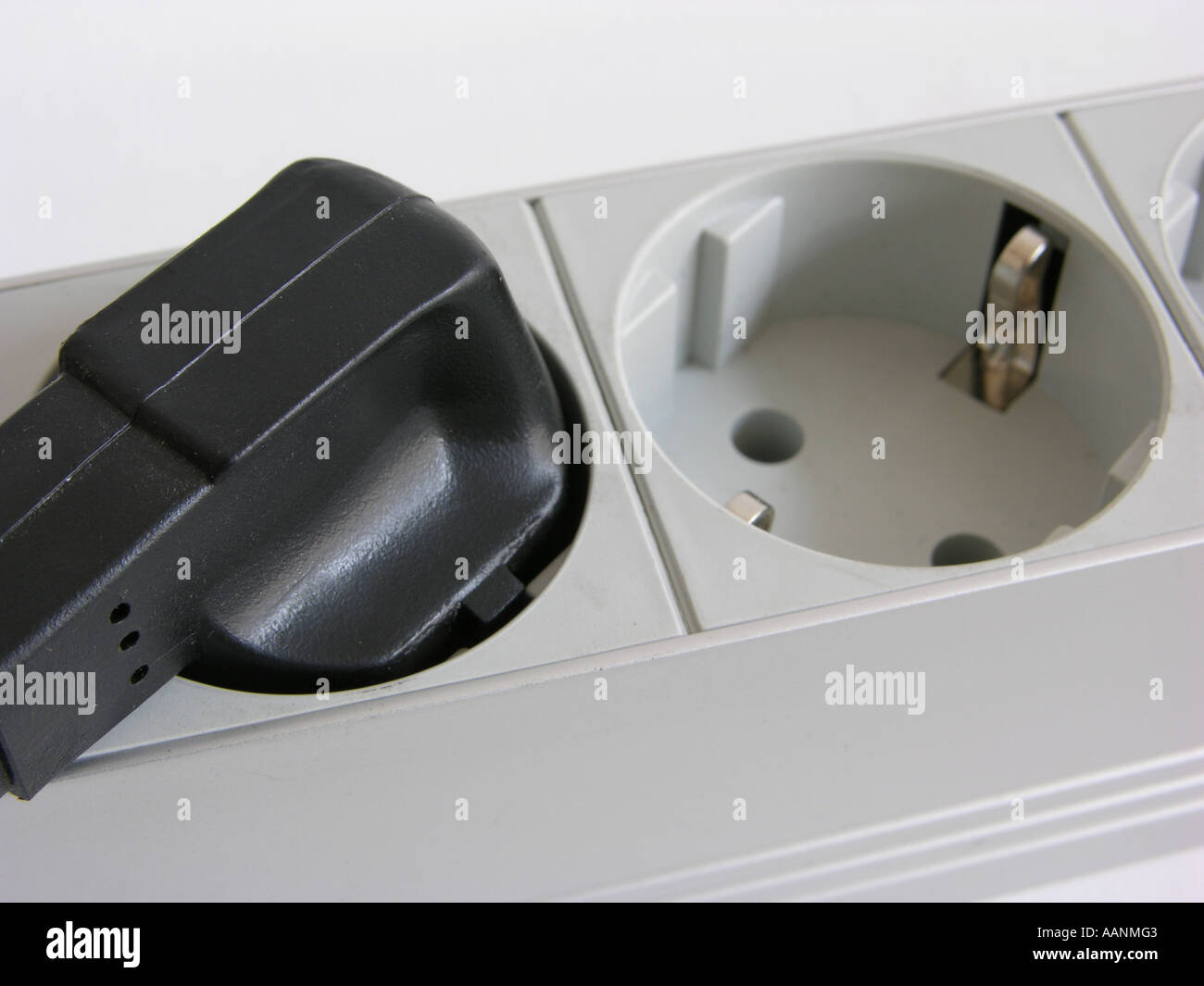 Power socket with a jack plugged in Stock Photo - Alamy