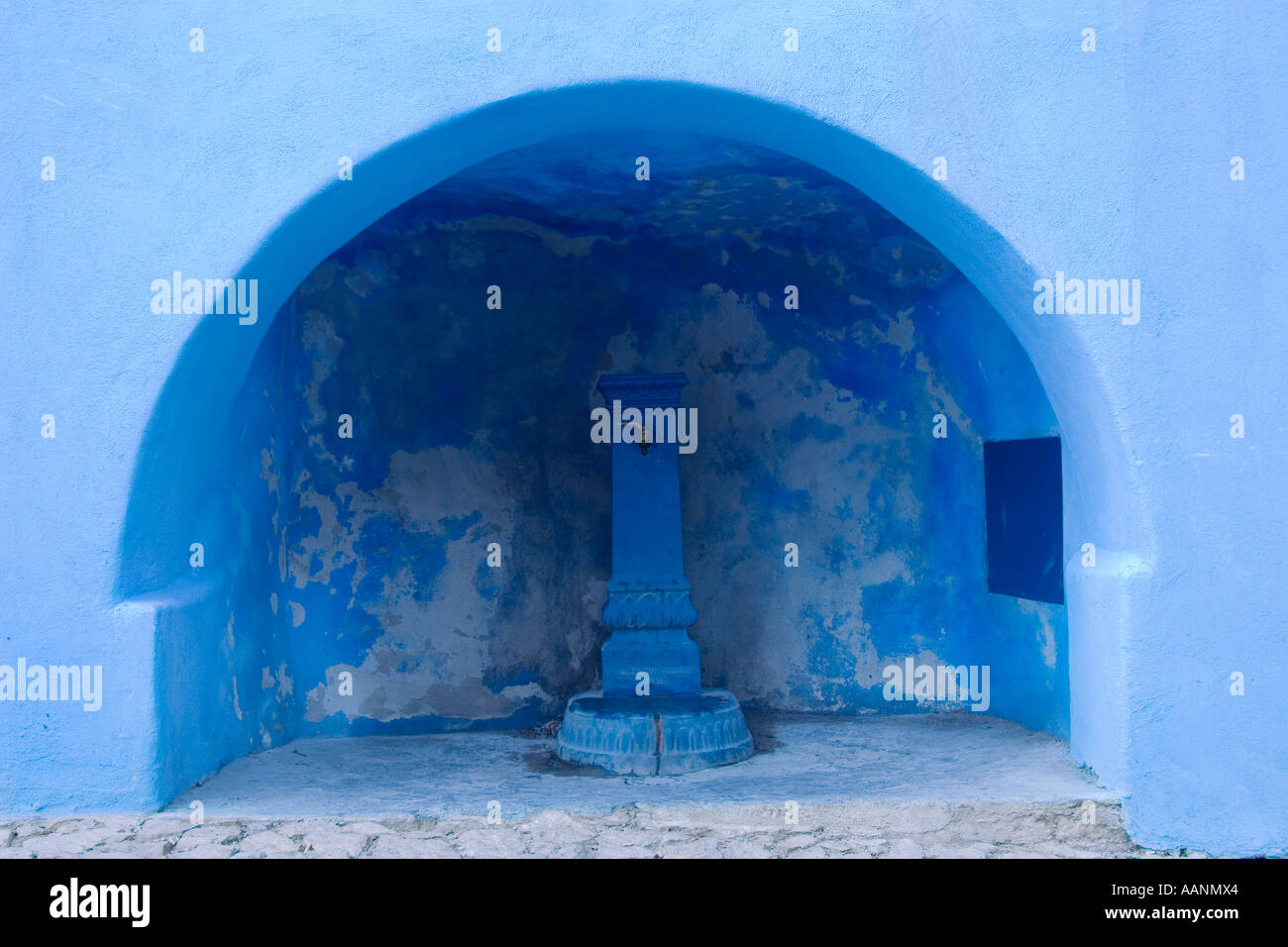 Blue well in a blue house in Posada, Sardinia, Italy Stock Photo - Alamy