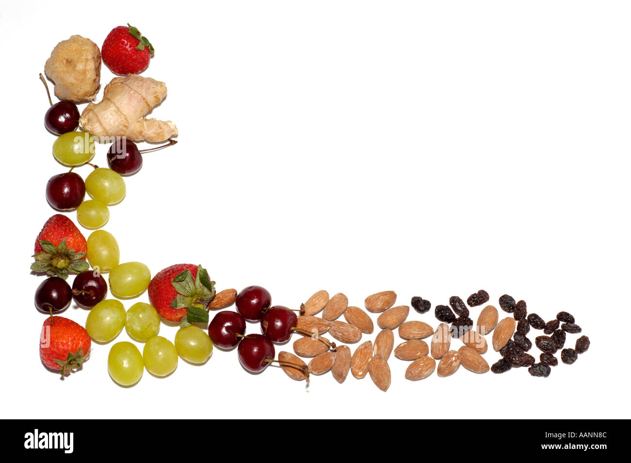 Assortment of fruits and food elements forming the letter L White ...