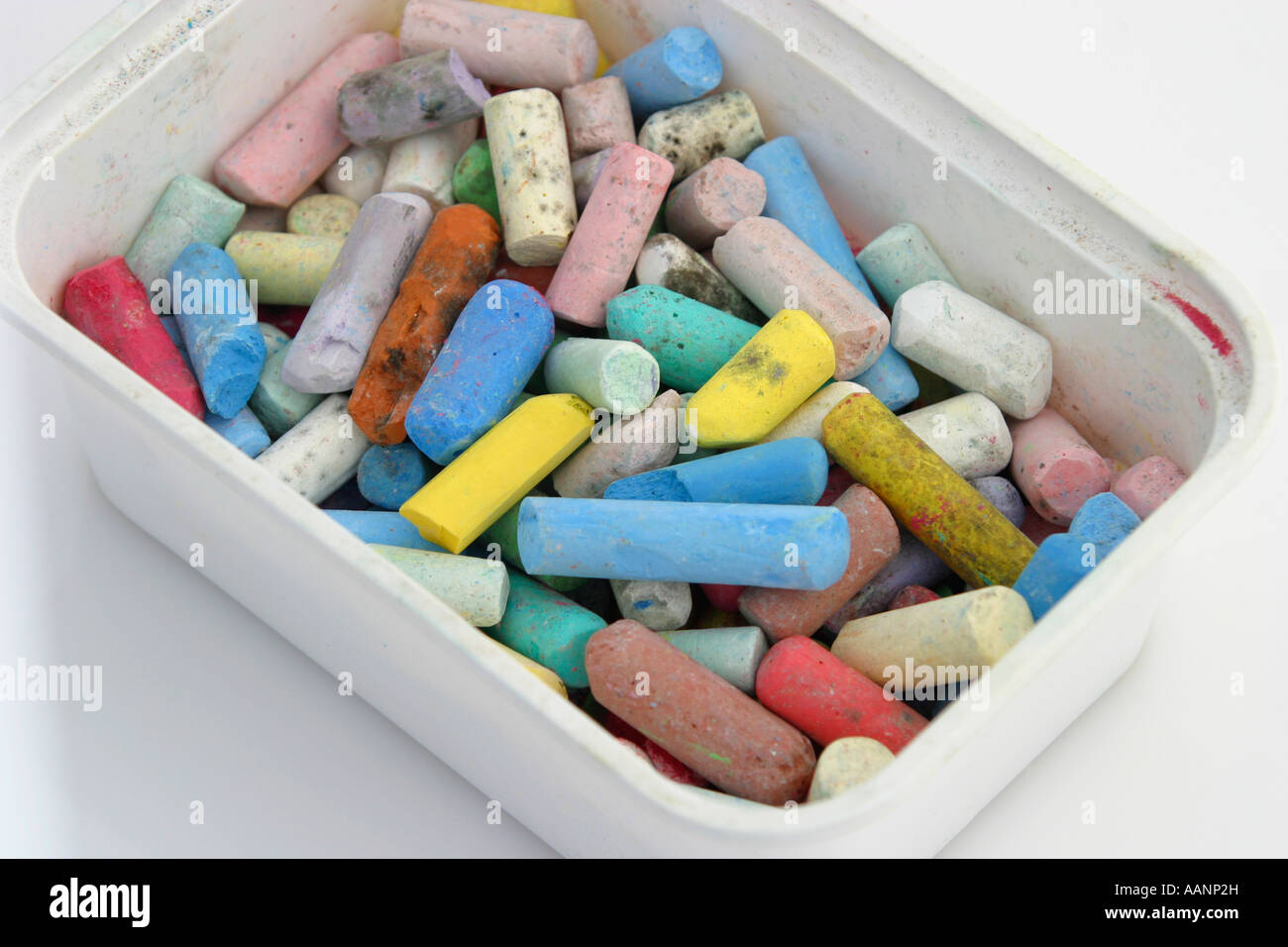 Childs coloured chalk in plastic tub Stock Photo - Alamy