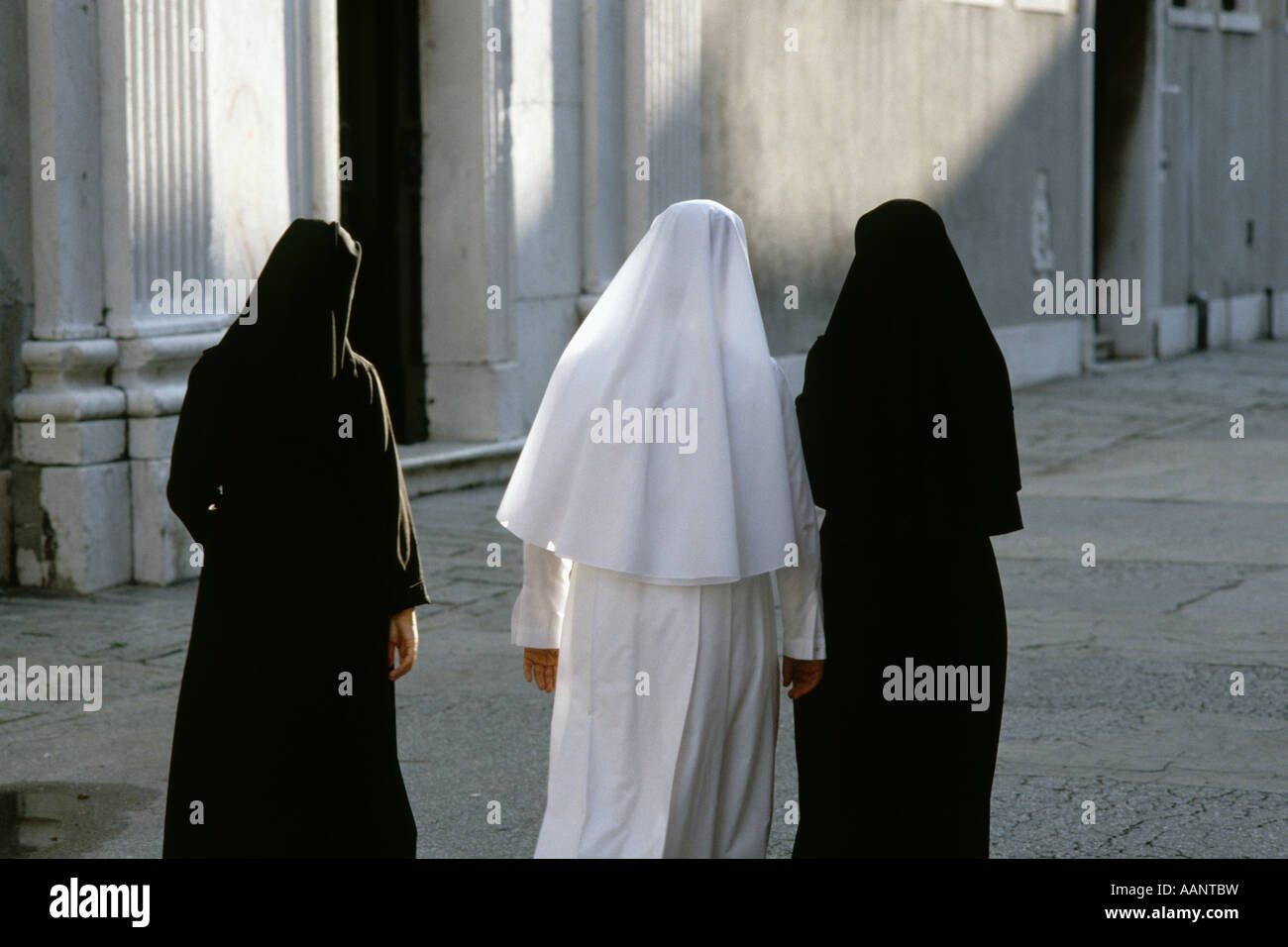 Rear view of three nuns, Venice, Italy Stock Photo - Alamy