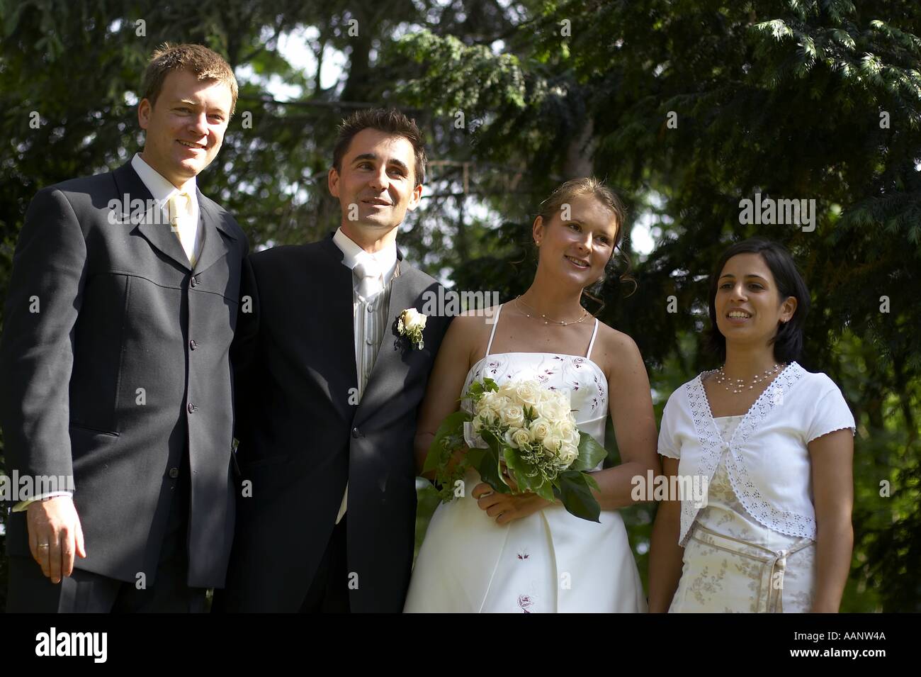 bridal couple with witnesses to marriage Stock Photo - Alamy