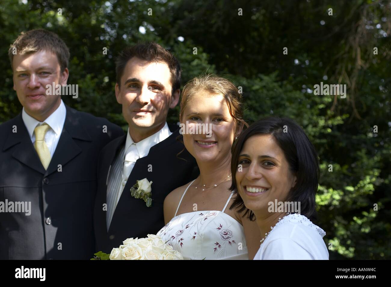 bridal couple with witnesses to marriage Stock Photo - Alamy