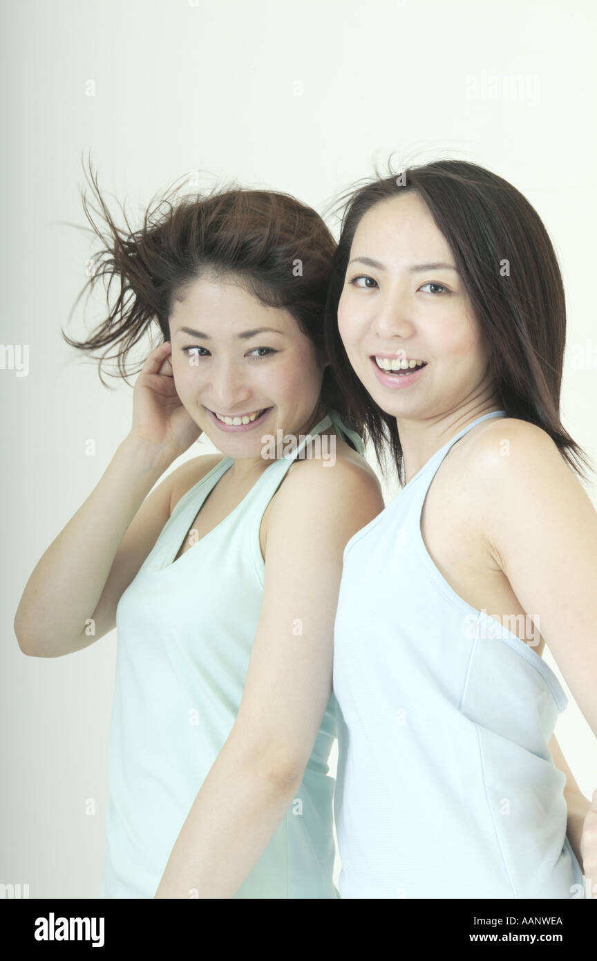 Two women smiling Stock Photo - Alamy