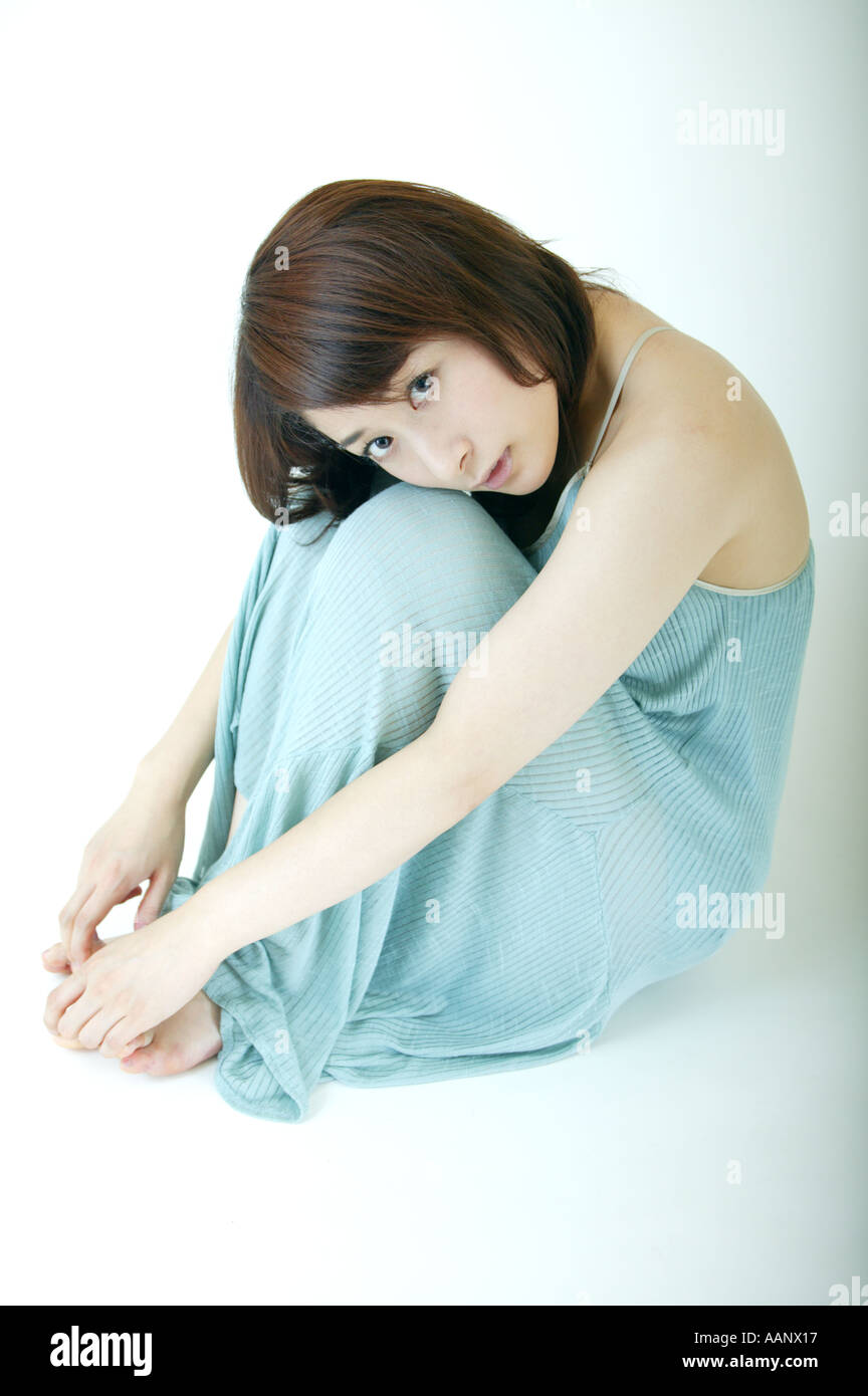 Hugging knee hi-res stock photography and images - Alamy