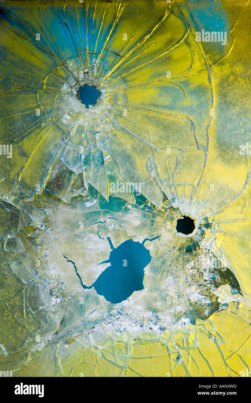 Bullet holes in fractured glass hi-res stock photography and images - Alamy