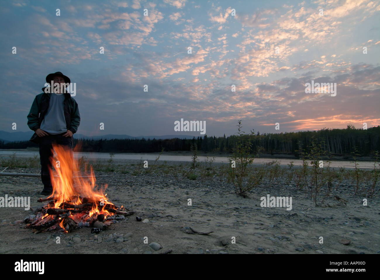 Campfire on a gravel island, Teslin River, Yukon, Canada Stock Photo ...