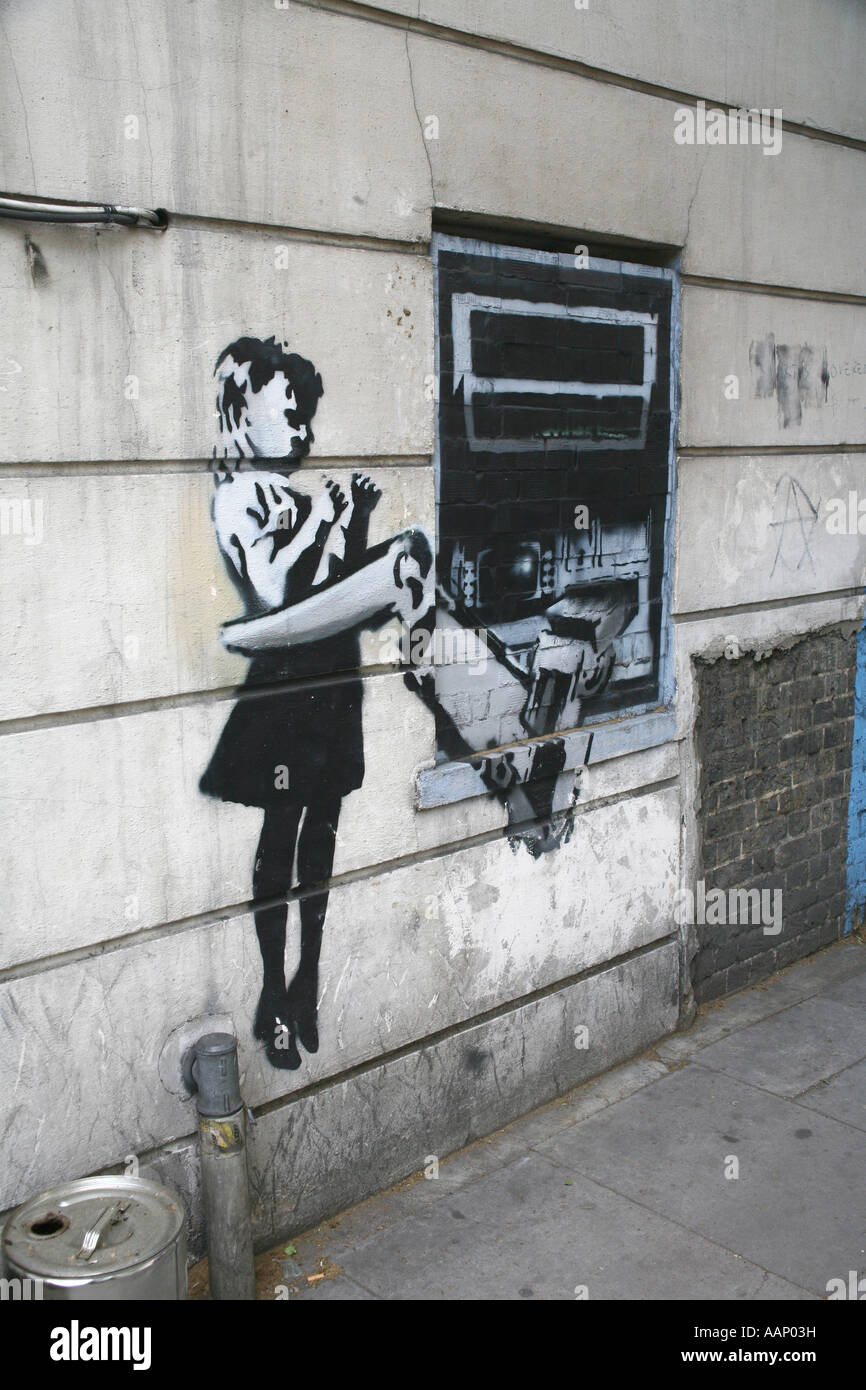 Banksy stencil of ATM grabbing a girl with it's mechanical arm Stock ...