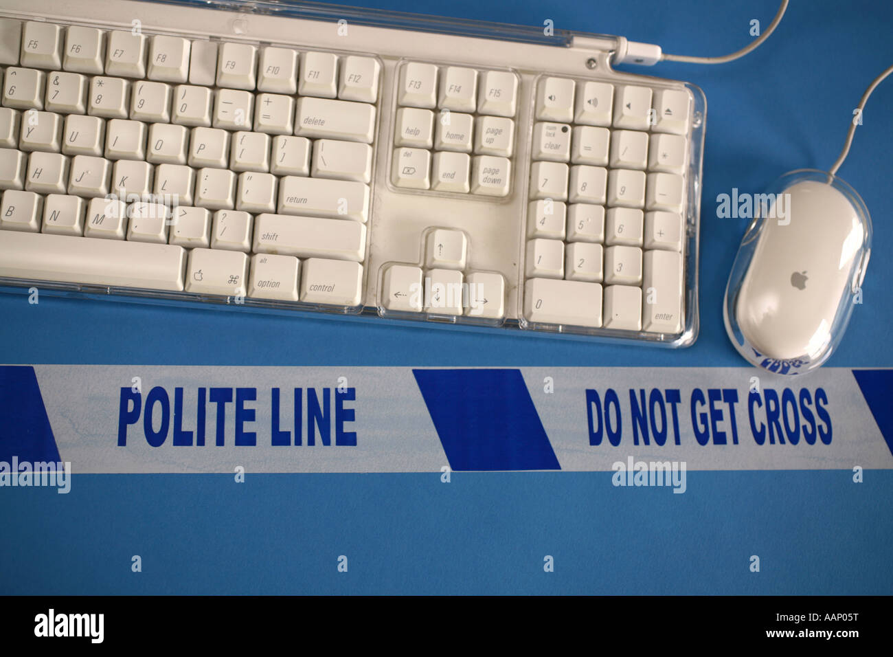 Polite Line Do Not Get Cross tape and computer keyboard Stock Photo - Alamy