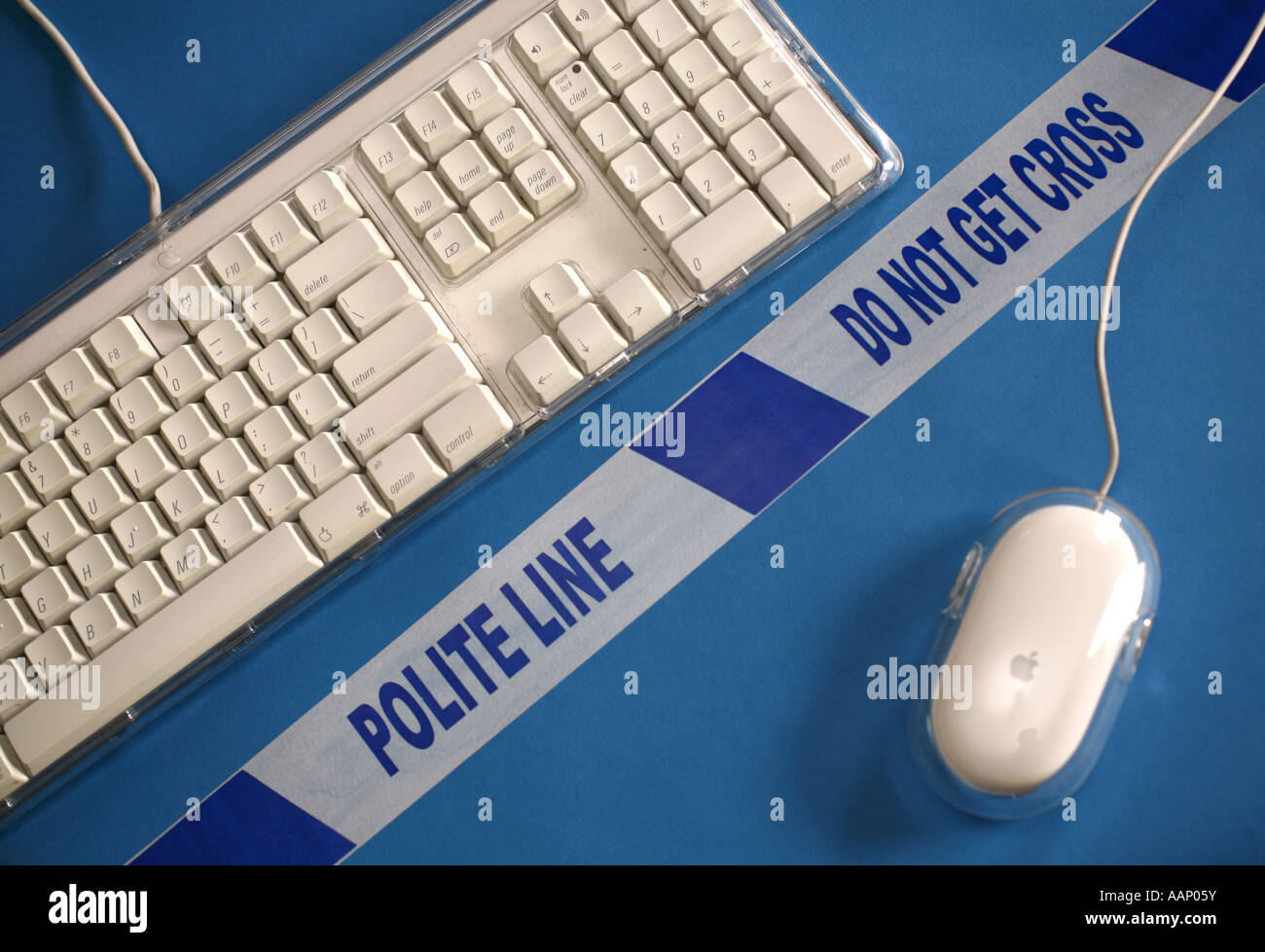 Polite Line Do Not Get Cross tape and computer keyboard Stock Photo - Alamy