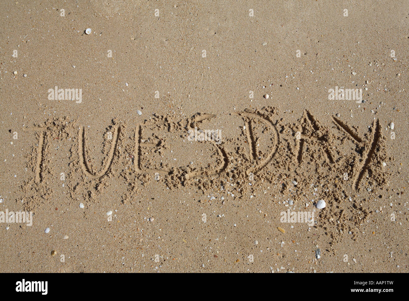 tuesday written on sand, weekdays Stock Photo - Alamy