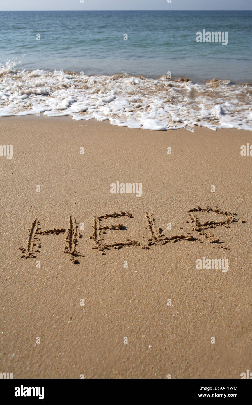help hand written on the sand Stock Photo - Alamy