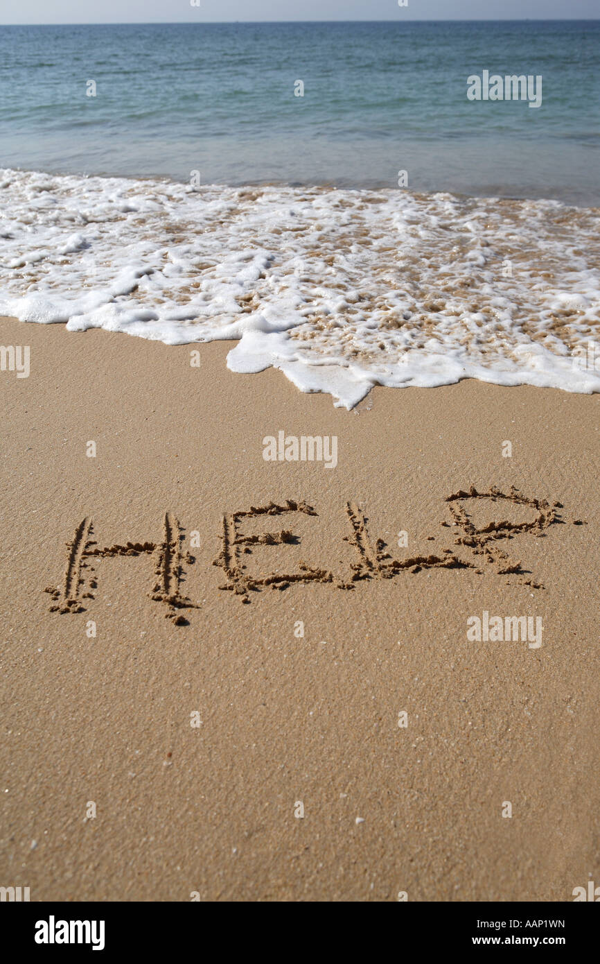 help hand written on the sand Stock Photo - Alamy