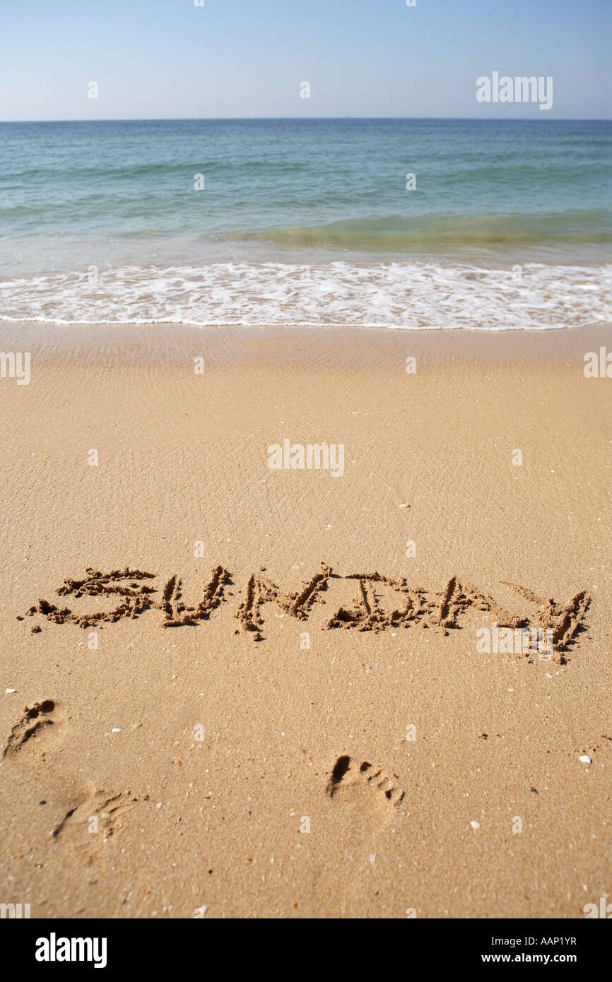 sunday written on sand, weekdays Stock Photo - Alamy