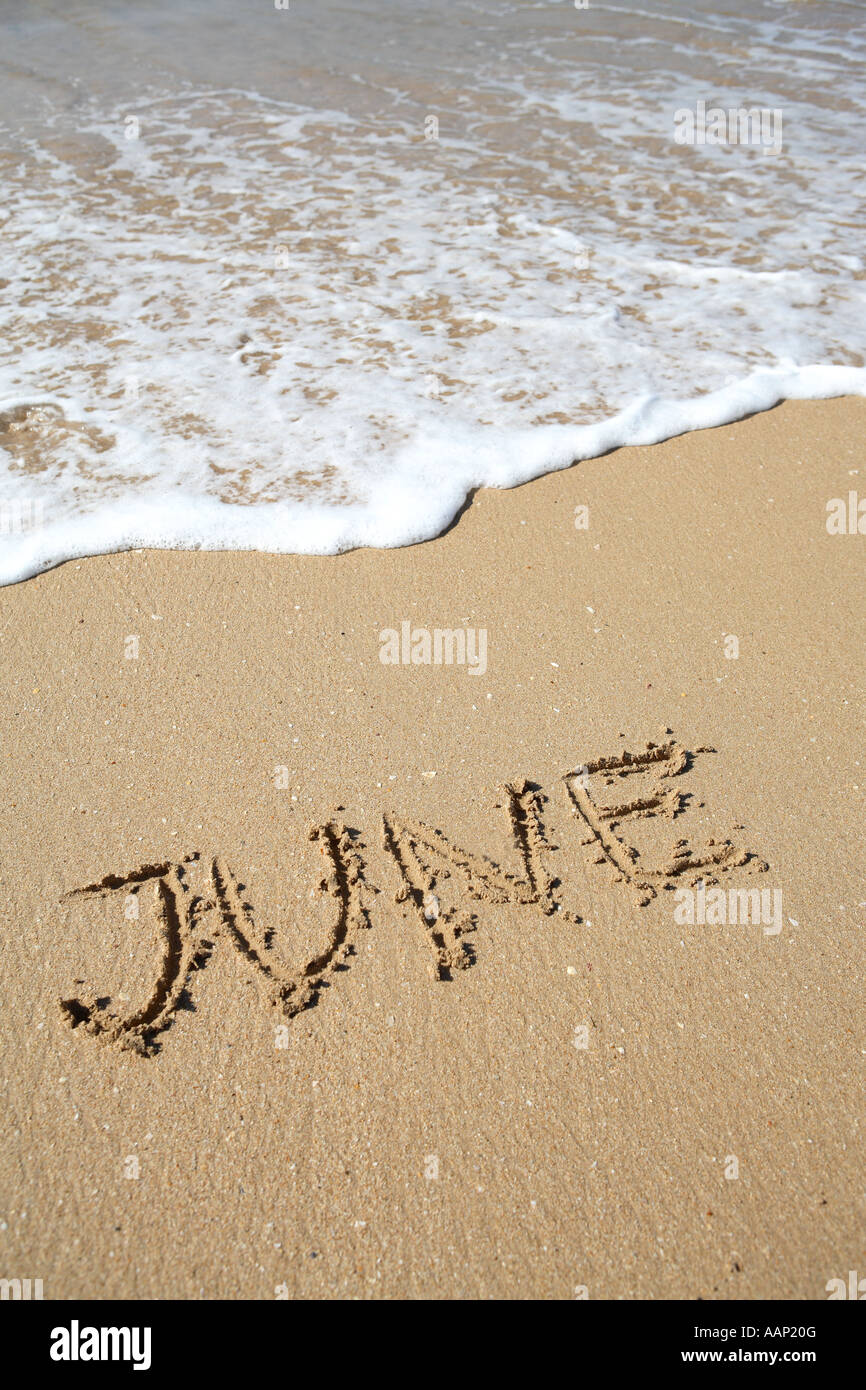 June written on sand summer hi-res stock photography and images - Alamy