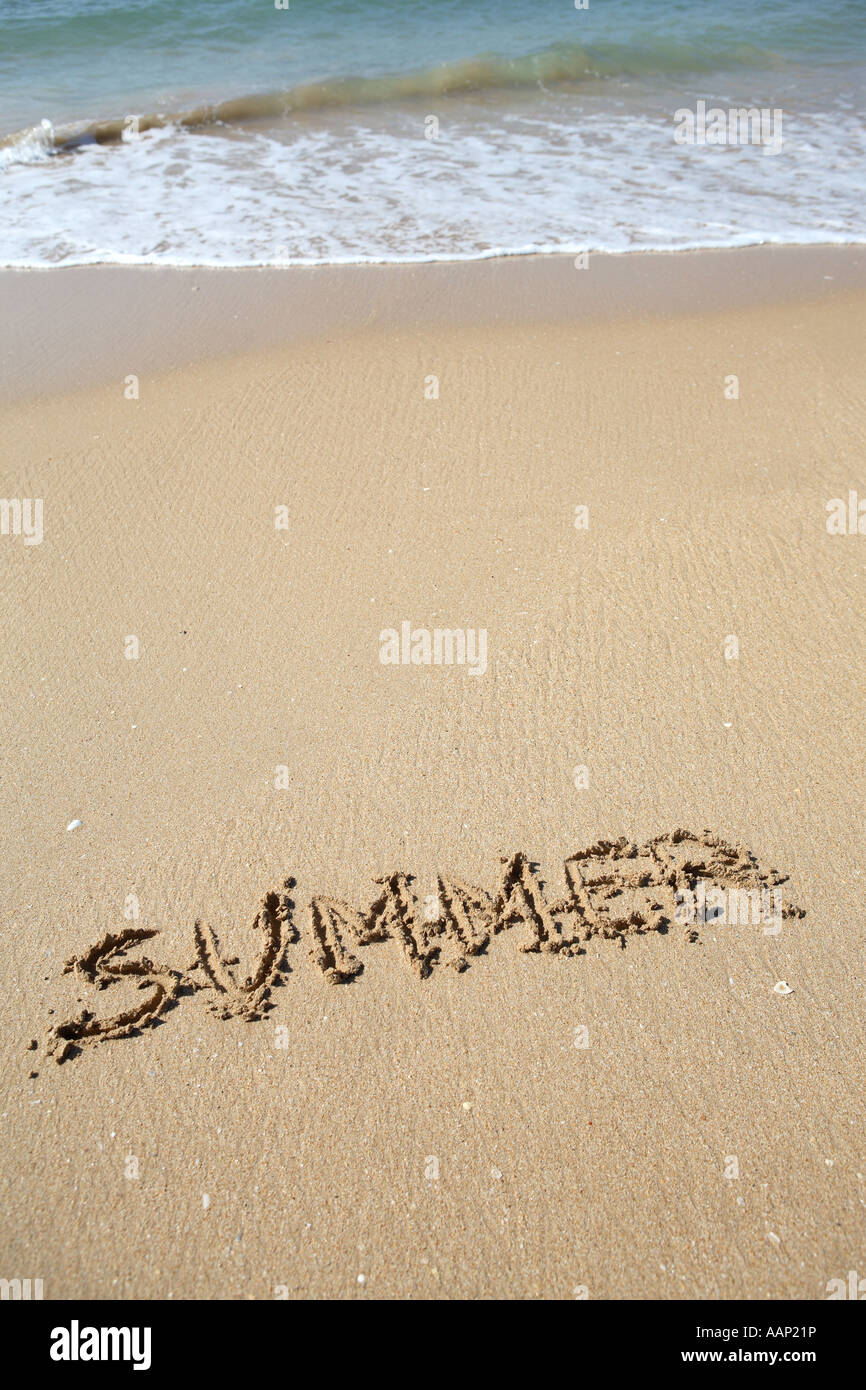 summer written on sand Stock Photo - Alamy