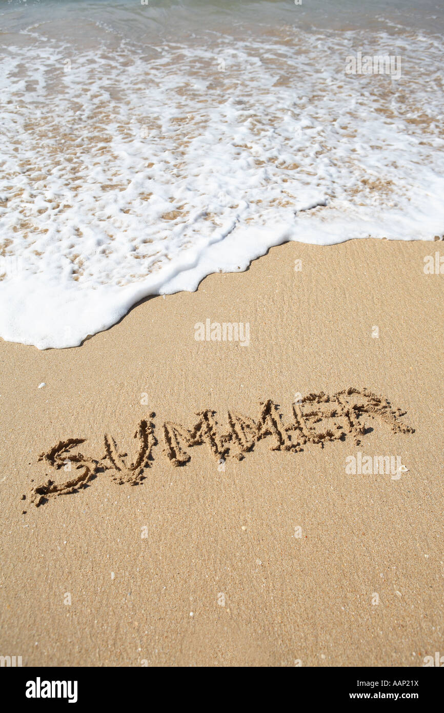 summer written on sand Stock Photo - Alamy