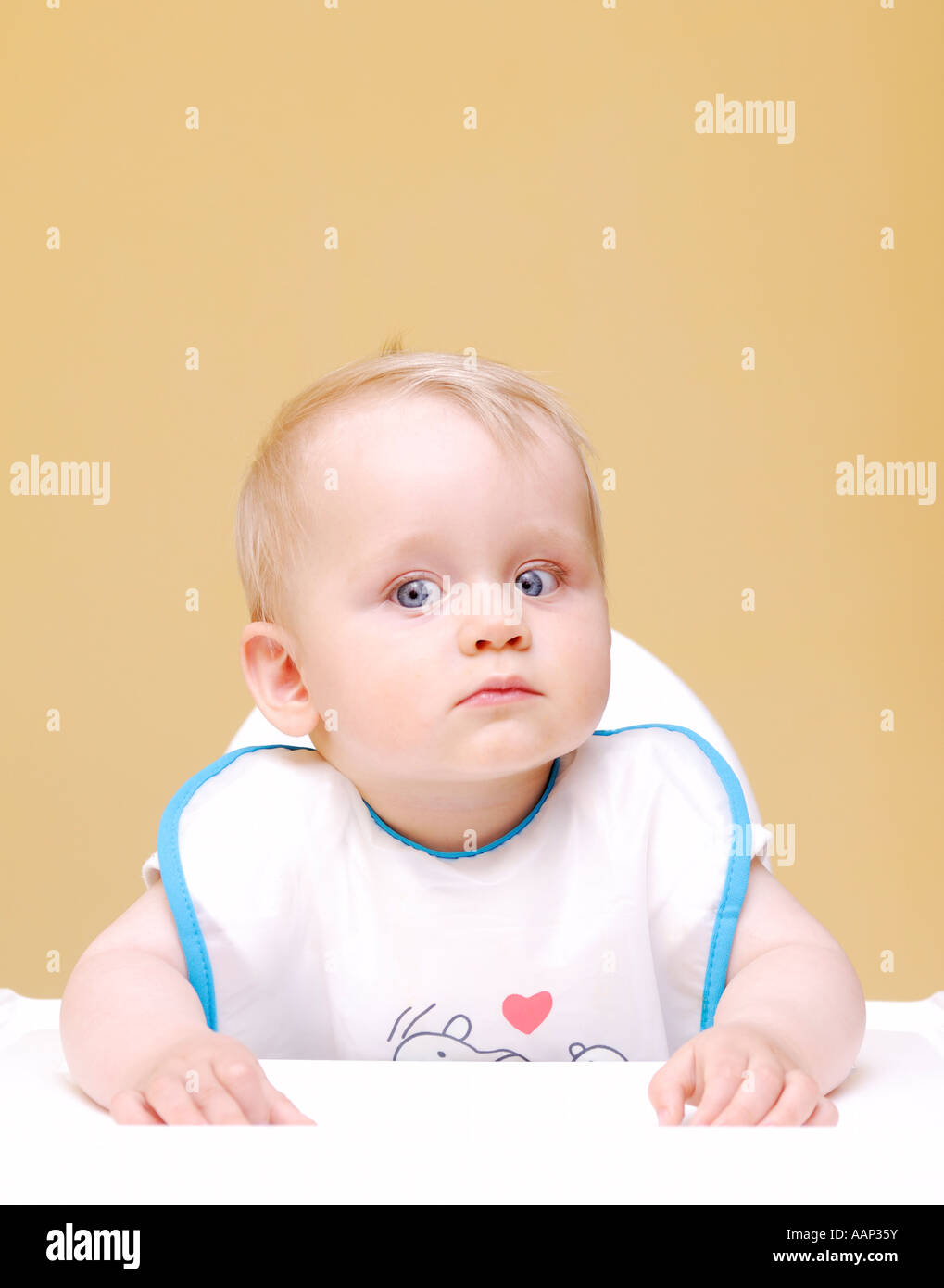 Baby in high chair Stock Photo - Alamy