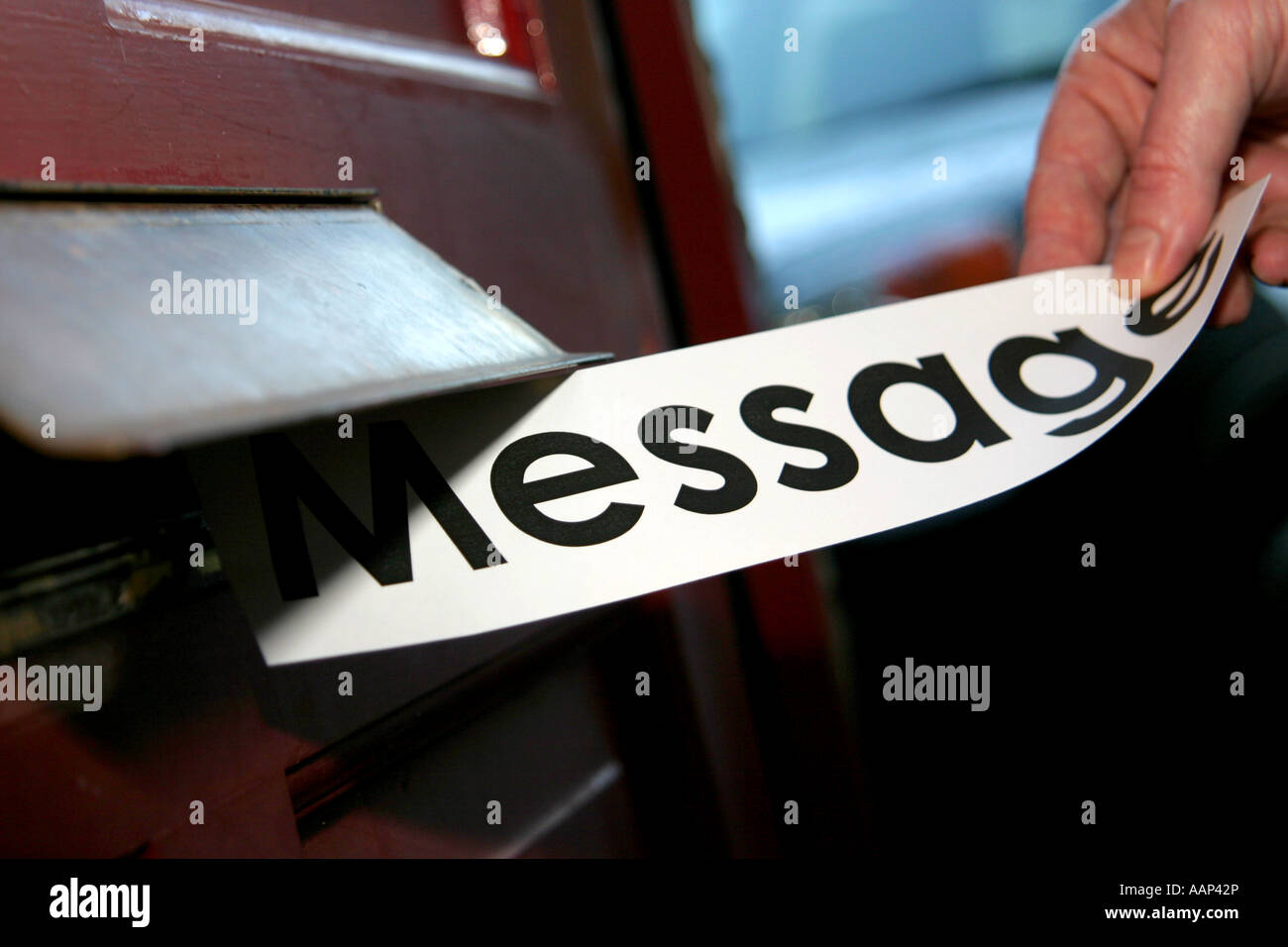 The word 'message' on a piece of paper being delivered through a ...