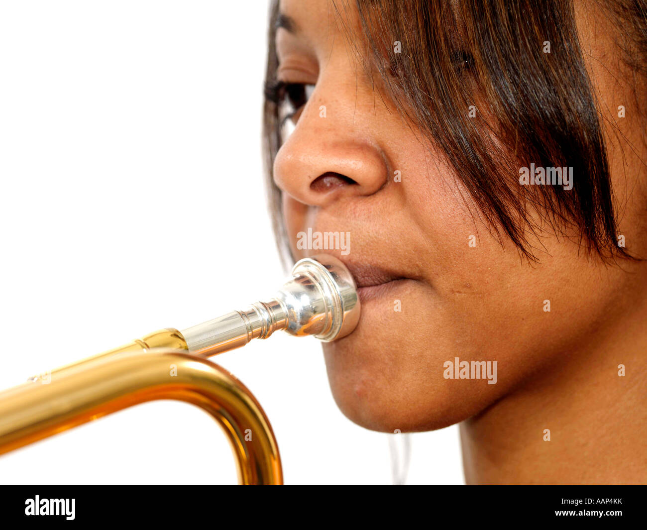 Young woman playing trumpet hi-res stock photography and images - Alamy