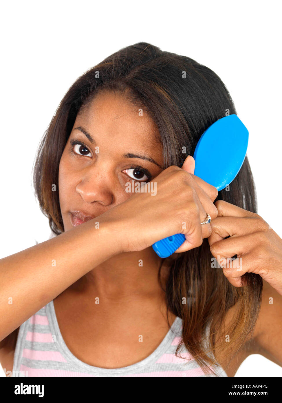 Woman brushing long dark hair with hairbrush hi-res stock photography ...