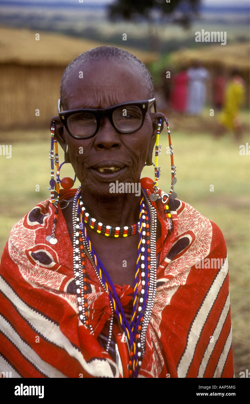 An elderly Maasai woman in traditional dress wearing spectacles Masai ...