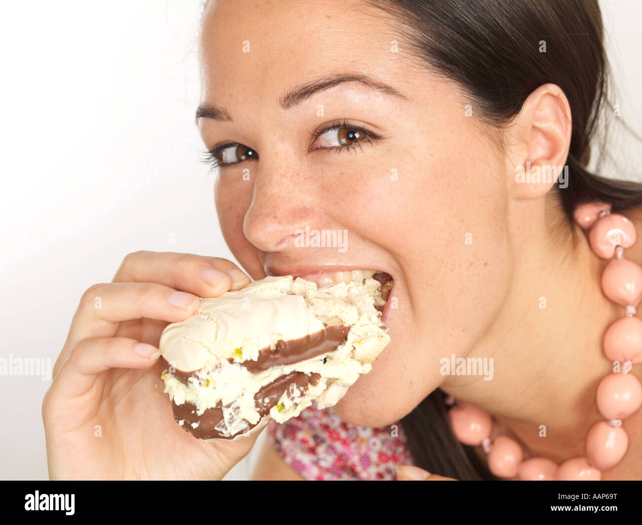 Young Woman Eating Cream Meringue Model Released Stock Photo - Alamy