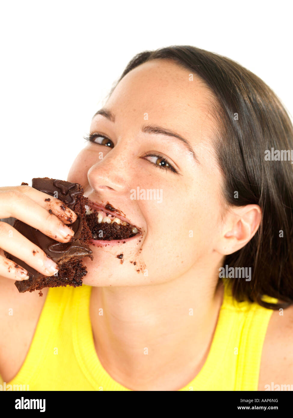 Young Woman Eating Chocolate Fudge Cake Model Released Stock Photo - Alamy