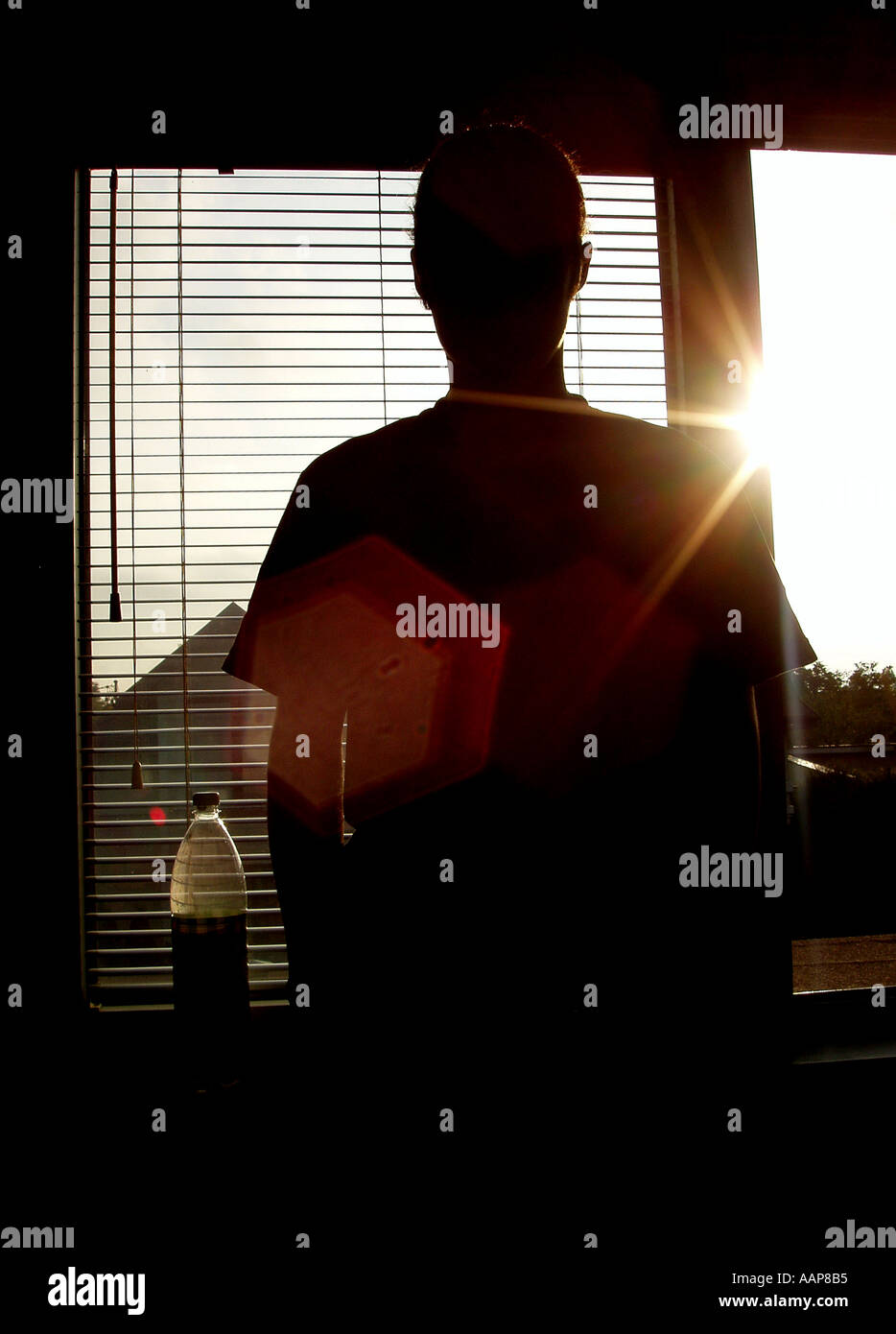 man looking thru window Stock Photo - Alamy