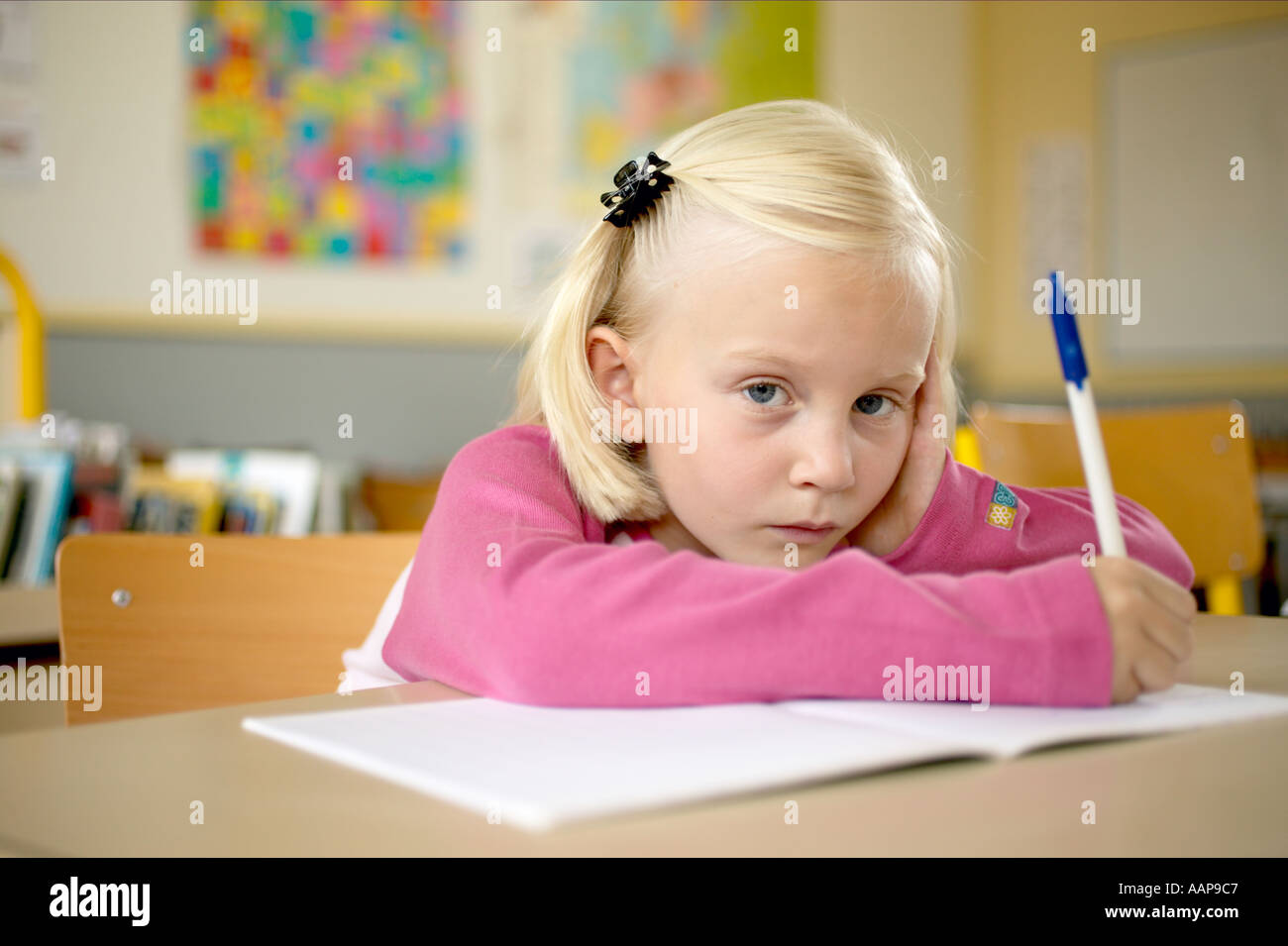 young girl writing in school Stock Photo - Alamy