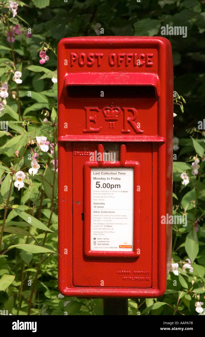 Shiny red letterbox in the English Lake District Stock Photo - Alamy