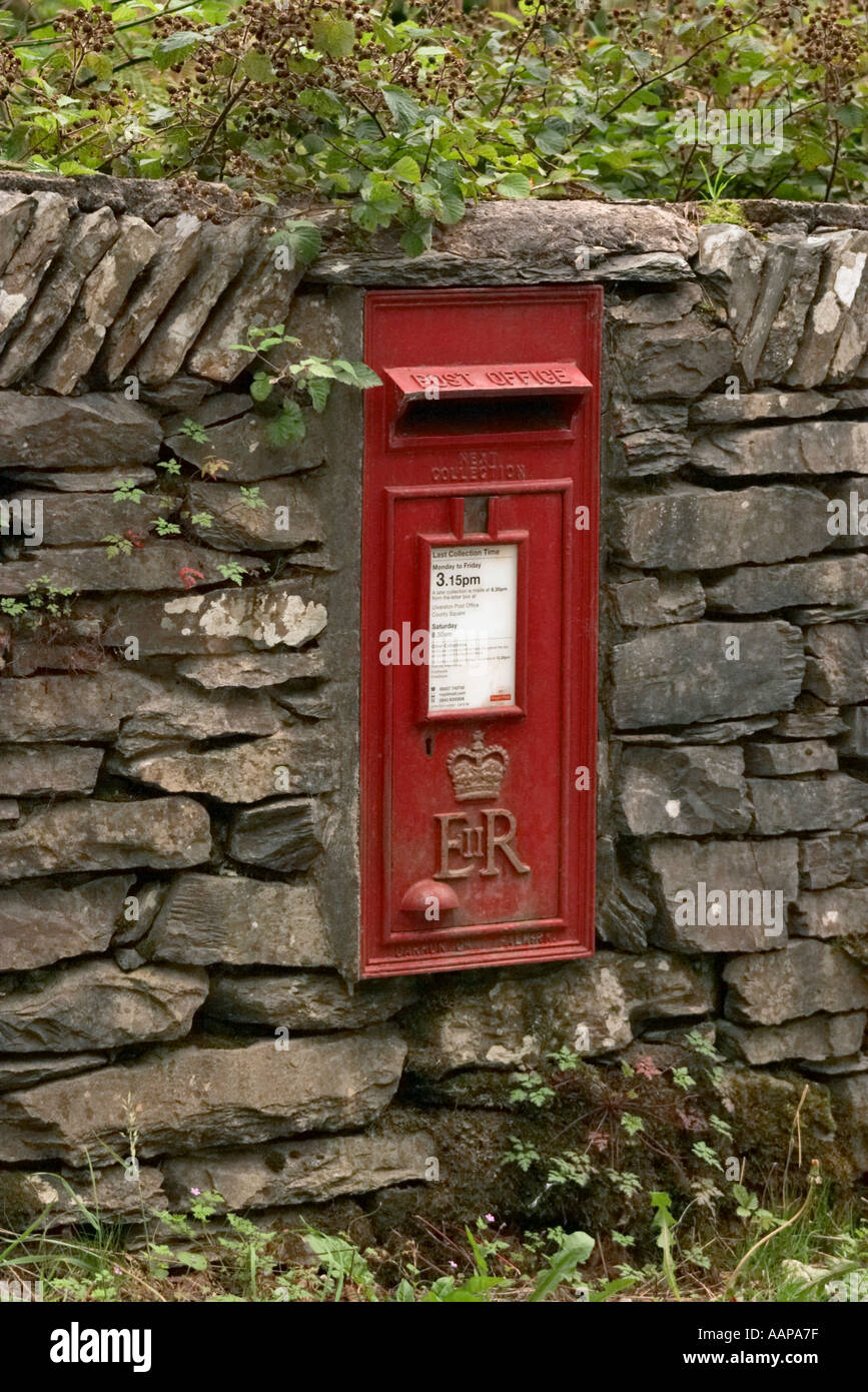 Red Royal Mail Post Office English letter box in rural dry stone wall ...