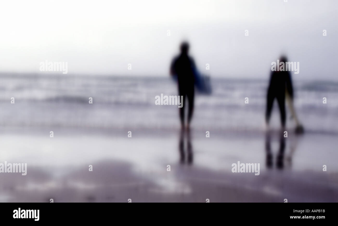 Two Surfers running into the sea Stock Photo - Alamy