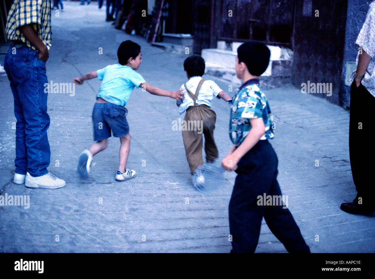 Children playing in the street Stock Photo - Alamy
