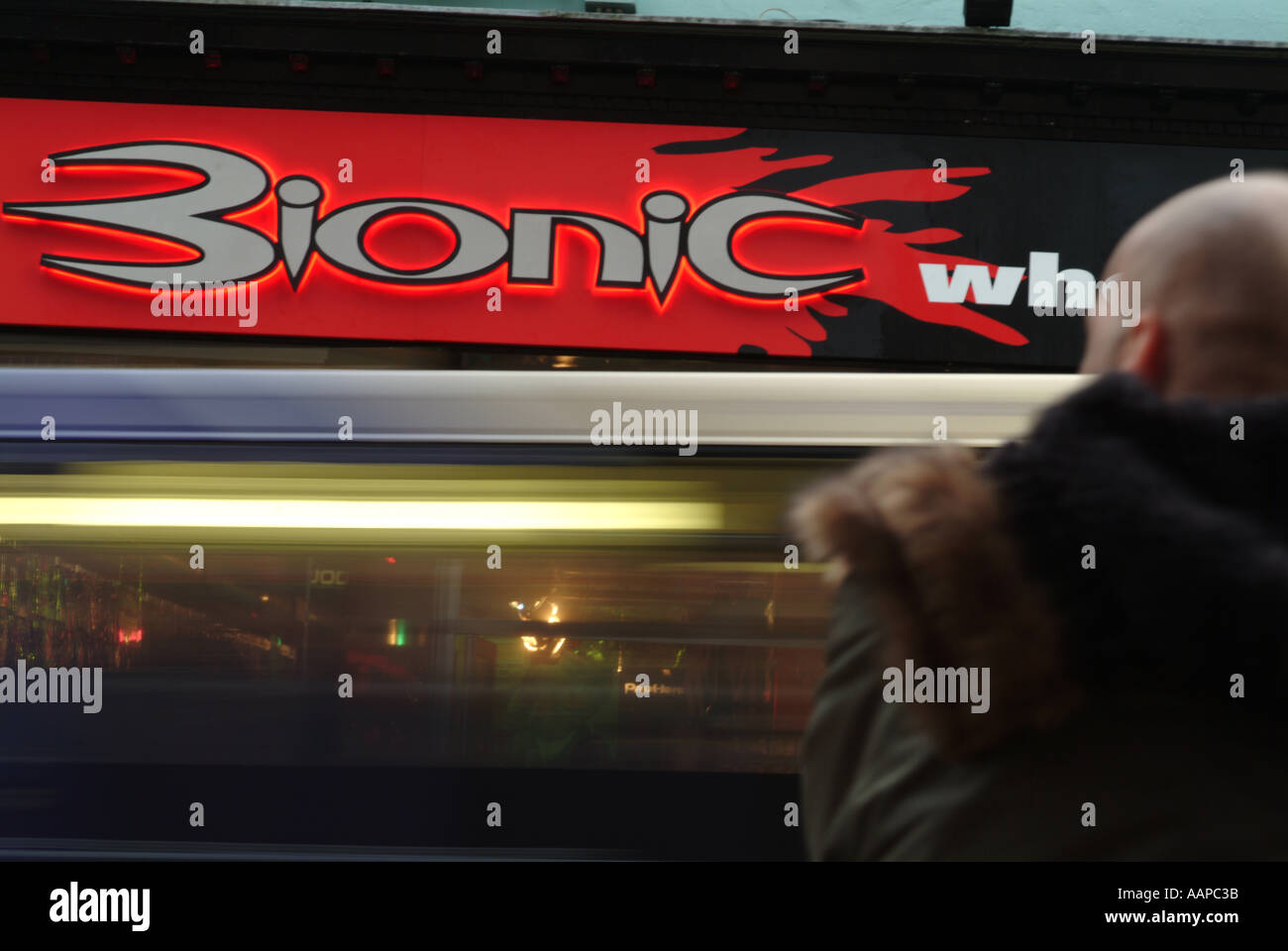 man looking at shop sign Stock Photo - Alamy