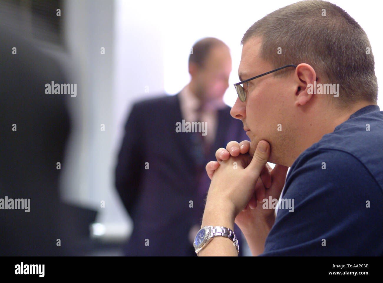 Man thinking during meeting Stock Photo - Alamy