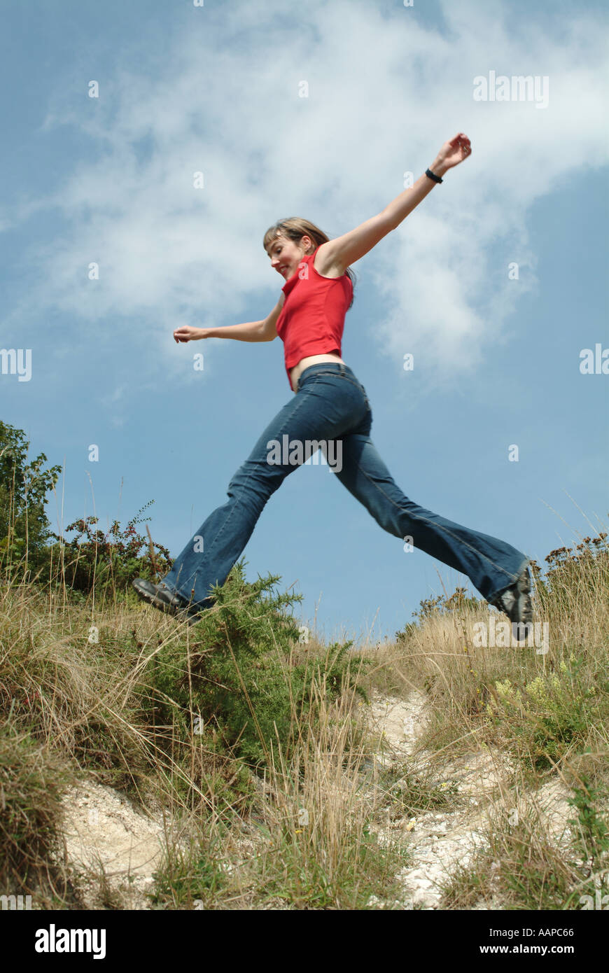 person jumping in the countryside Stock Photo - Alamy