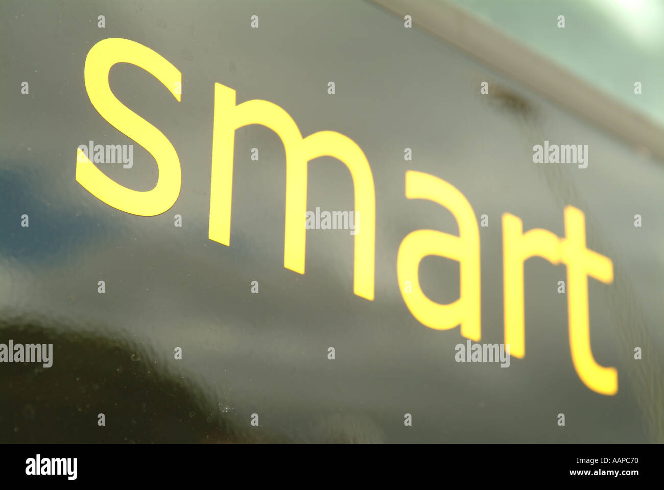 the word Smart vinyl lettering on a black door Stock Photo - Alamy