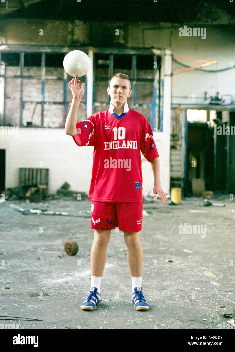 Colour portrait of young man spinning ball on finger Stock Photo - Alamy