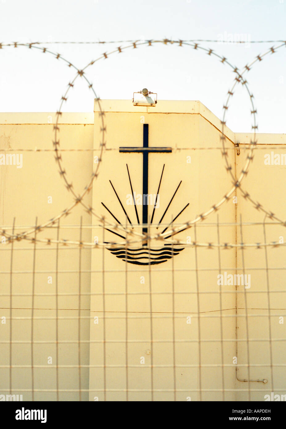 Holy church protected by barbed wire Stock Photo - Alamy