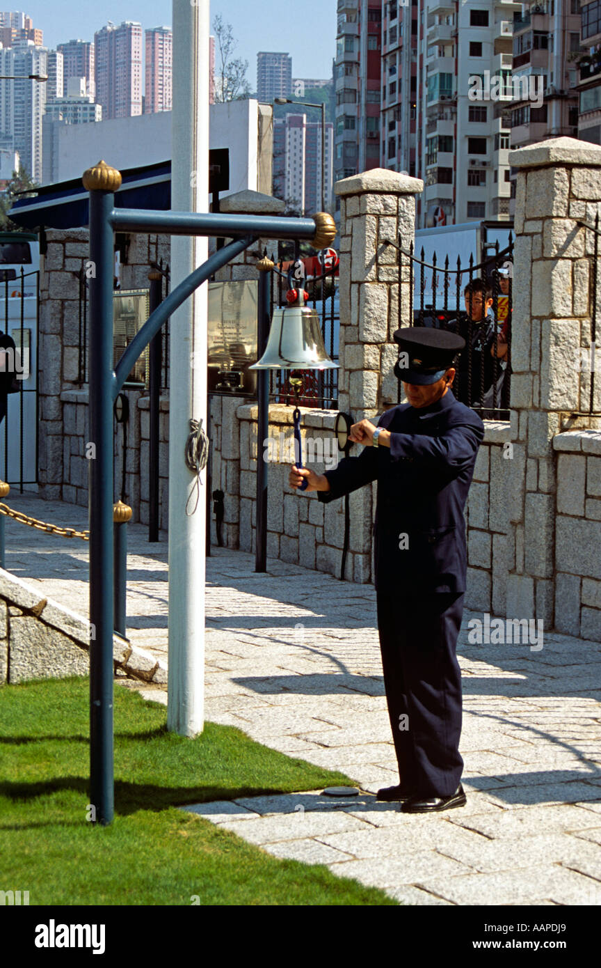 Noon Day Gun, uniformed official and bell, Causeway Bay, Hong Kong ...