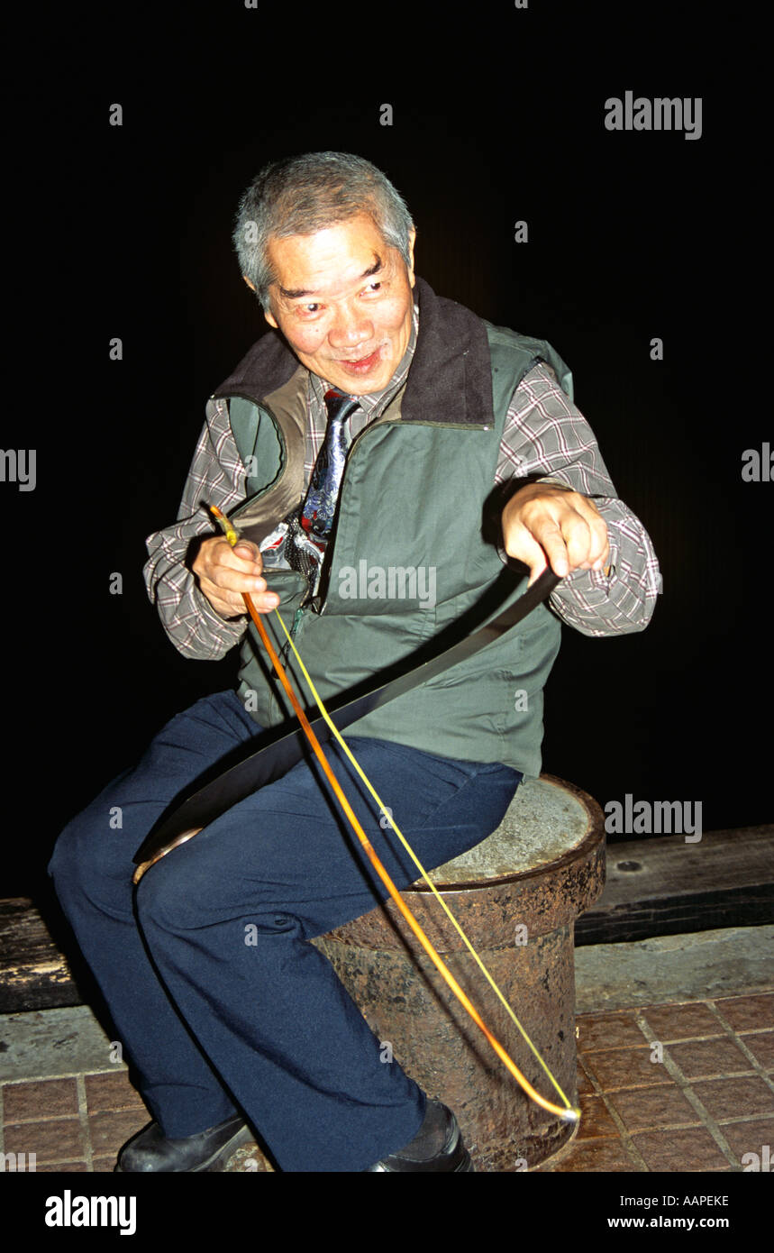Man Playing Saw High Resolution Stock Photography and Images - Alamy